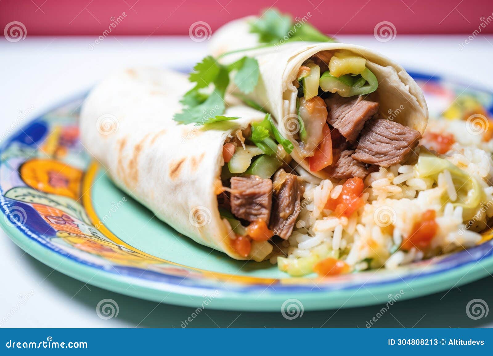 Beef Burrito Cut in Half, Showing Filling, on a Ceramic Dish Stock ...