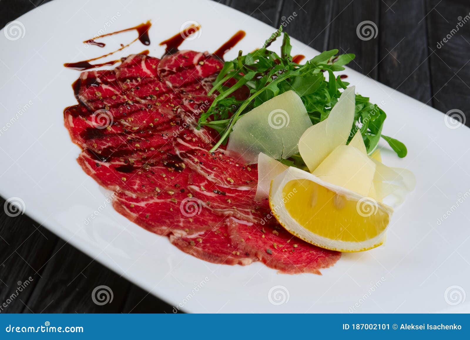 Beef Carpaccio with Cheese, White Bread Toasts and Lemon Stock Image ...