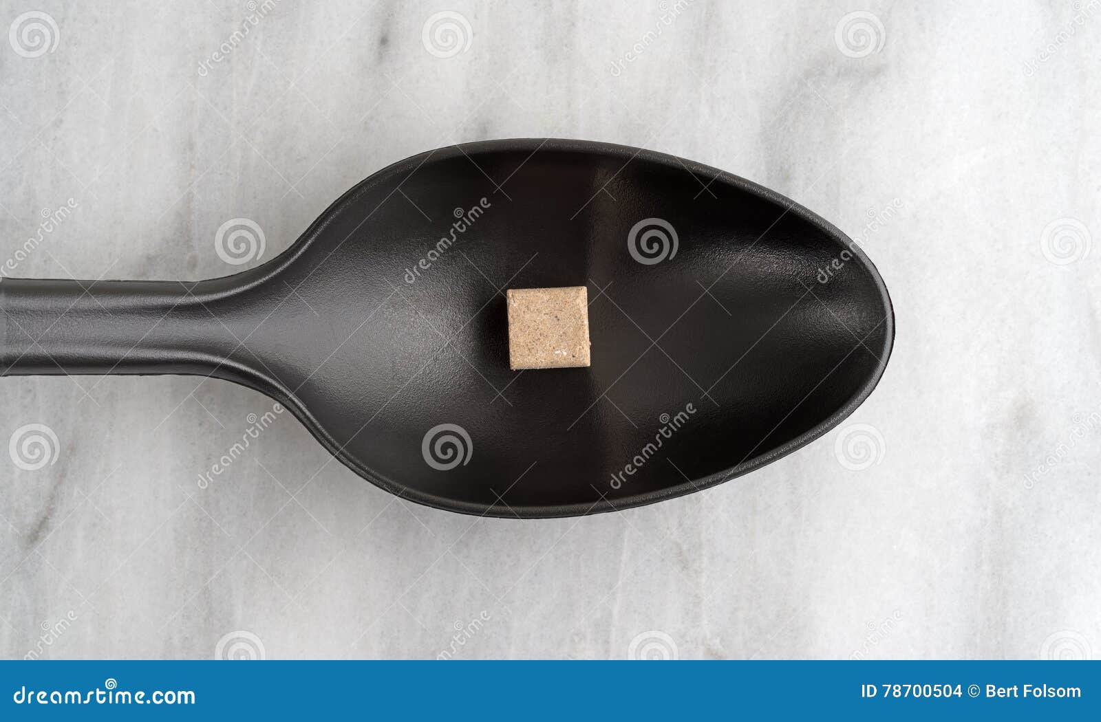Beef Flavored Bouillon Cube on a Black Spoon Stock Photo - Image of ...