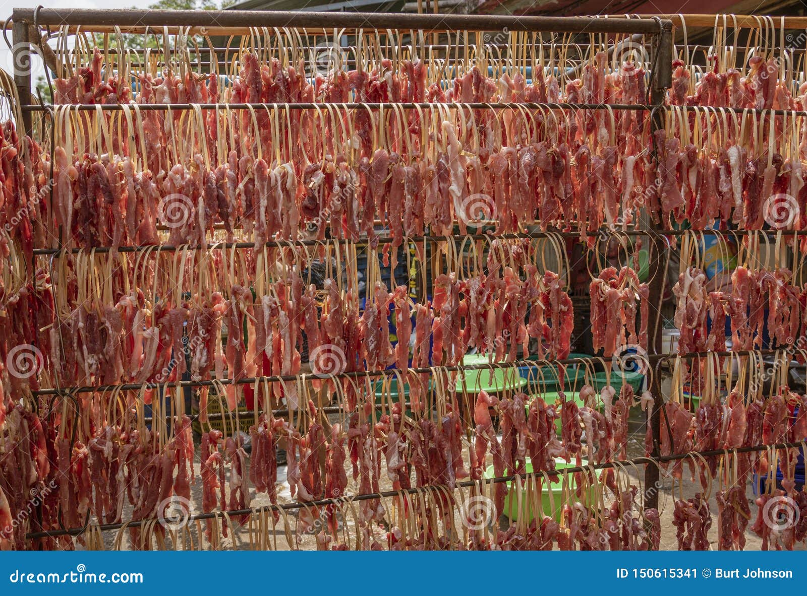 Beef Jerky Strips Hang on a Rack in the Sun Drying Stock Image - Image ...
