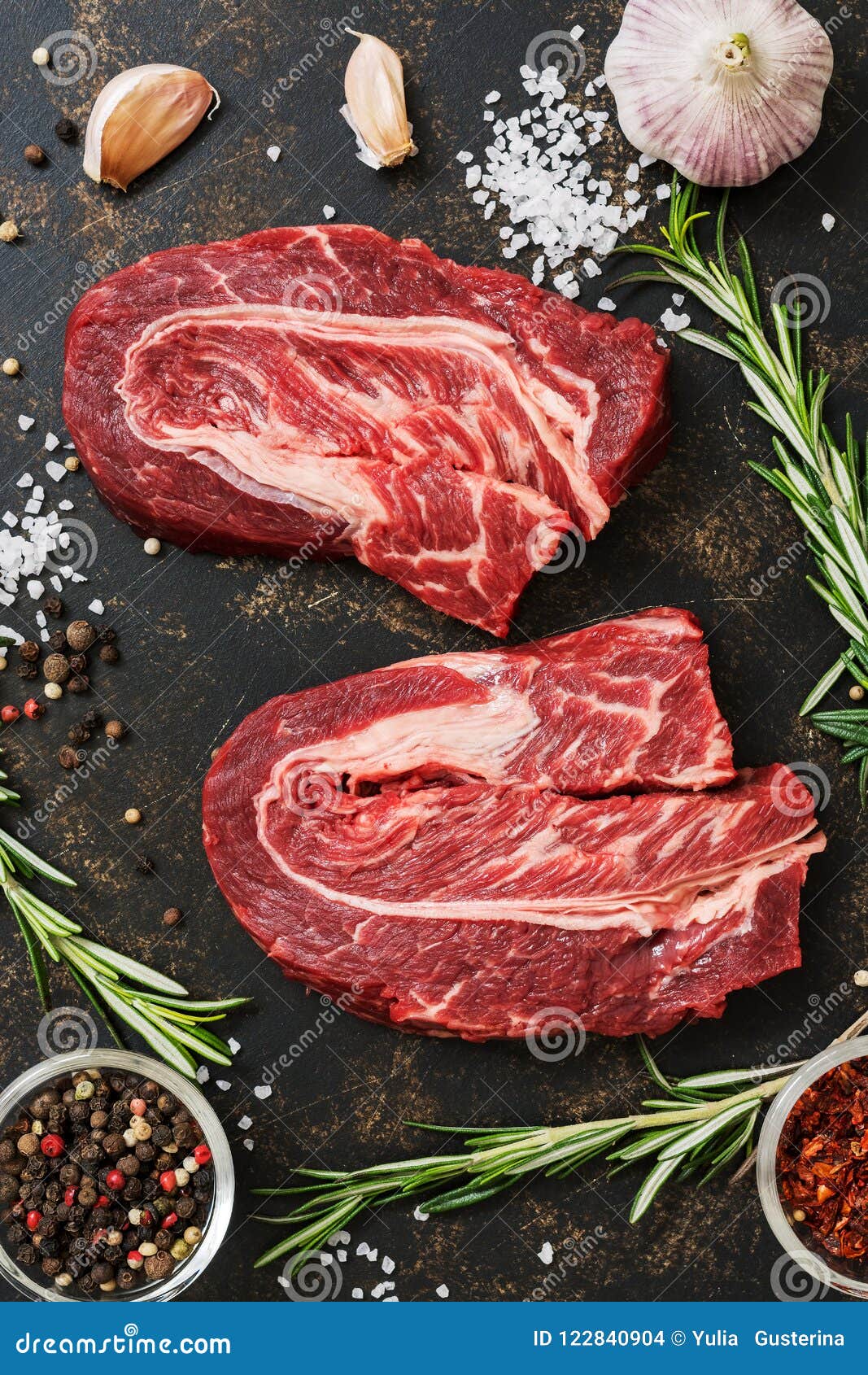 Beef Raw Steak on a Dark Rustic Background with Rosemary and Spices ...
