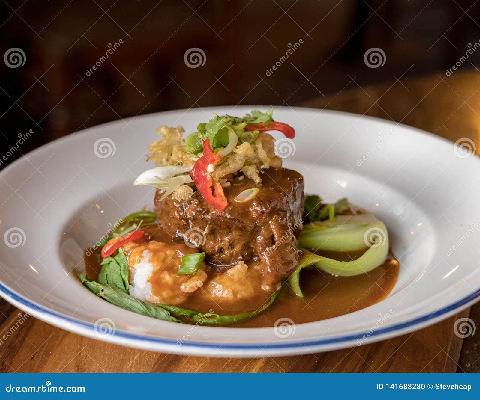 Beef Rendang Curry in White Bowl on Pub Table Stock Photo - Image of ...