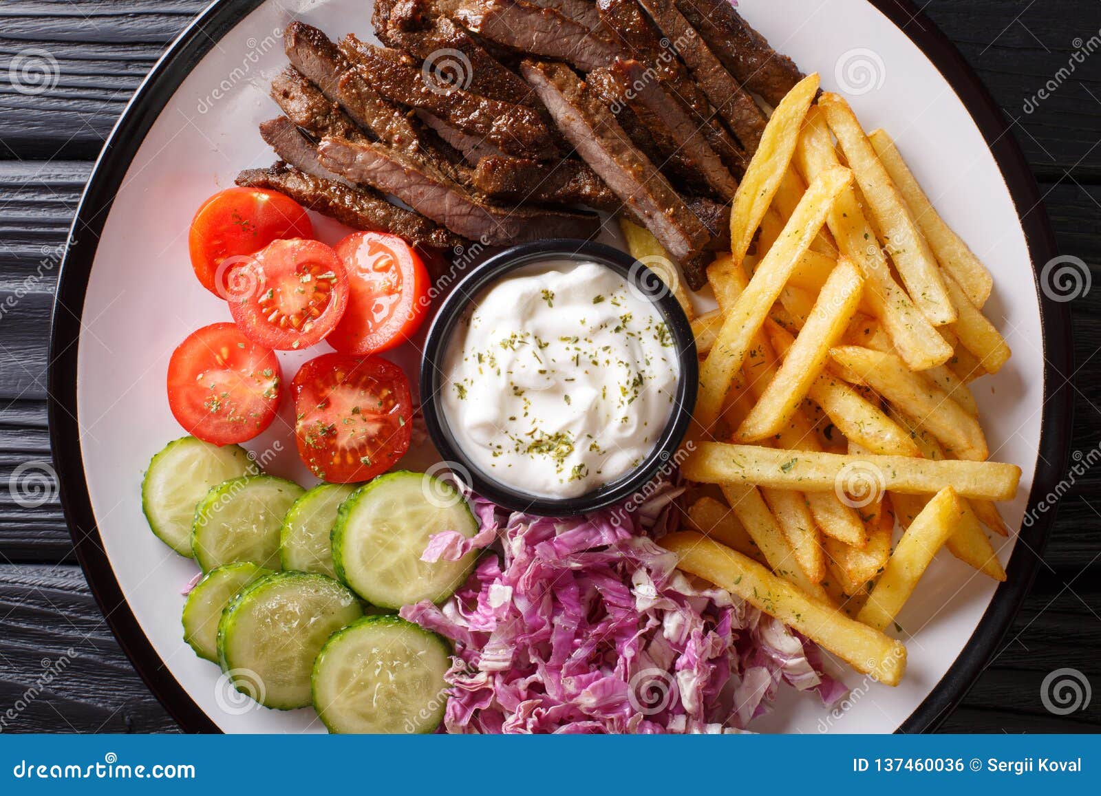 Beef Shawarma with Vegetables and Sauce Serving on a Plate Close-up ...