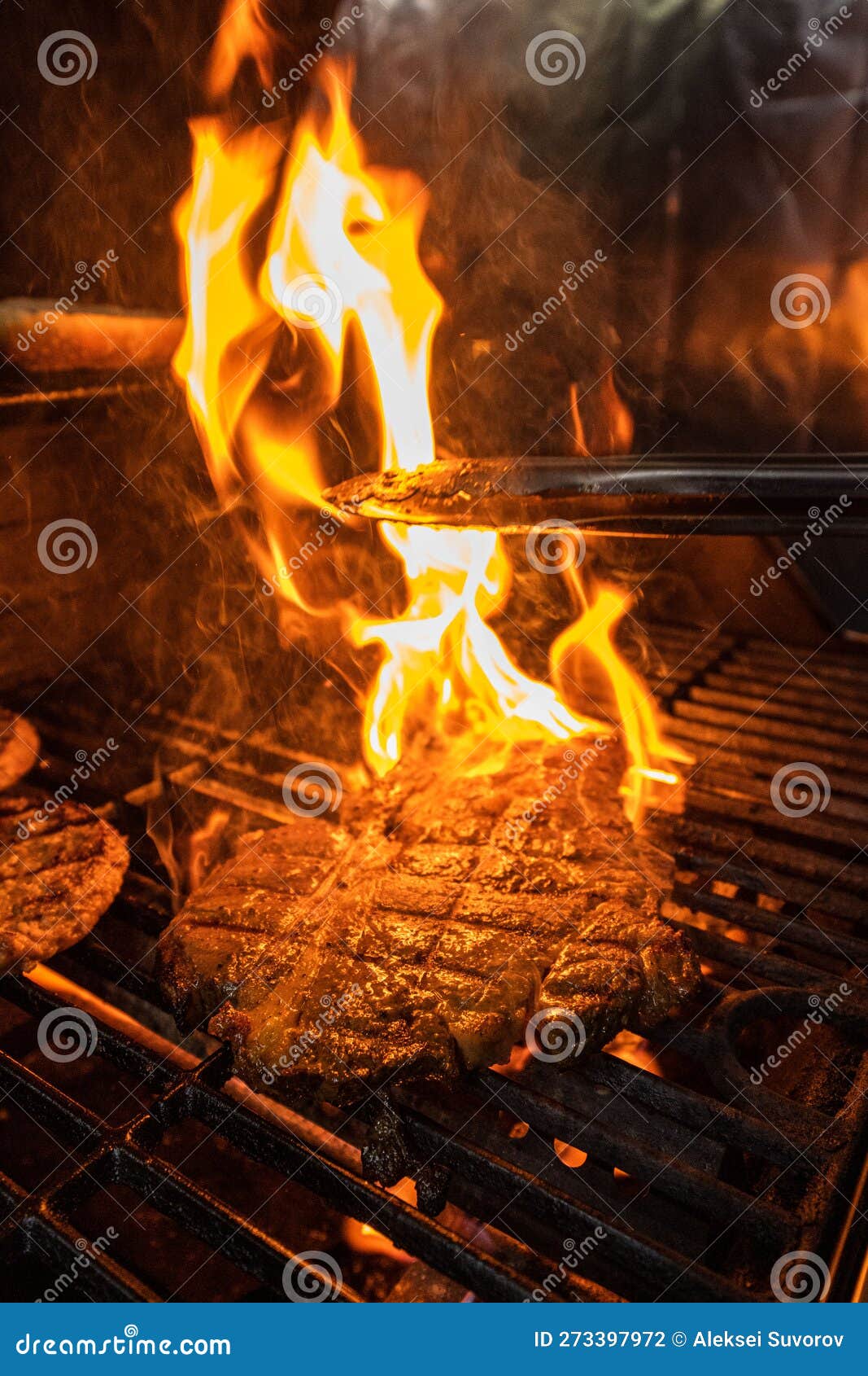 Beef Steak on the Grill with Flames Stock Photo - Image of cookout ...