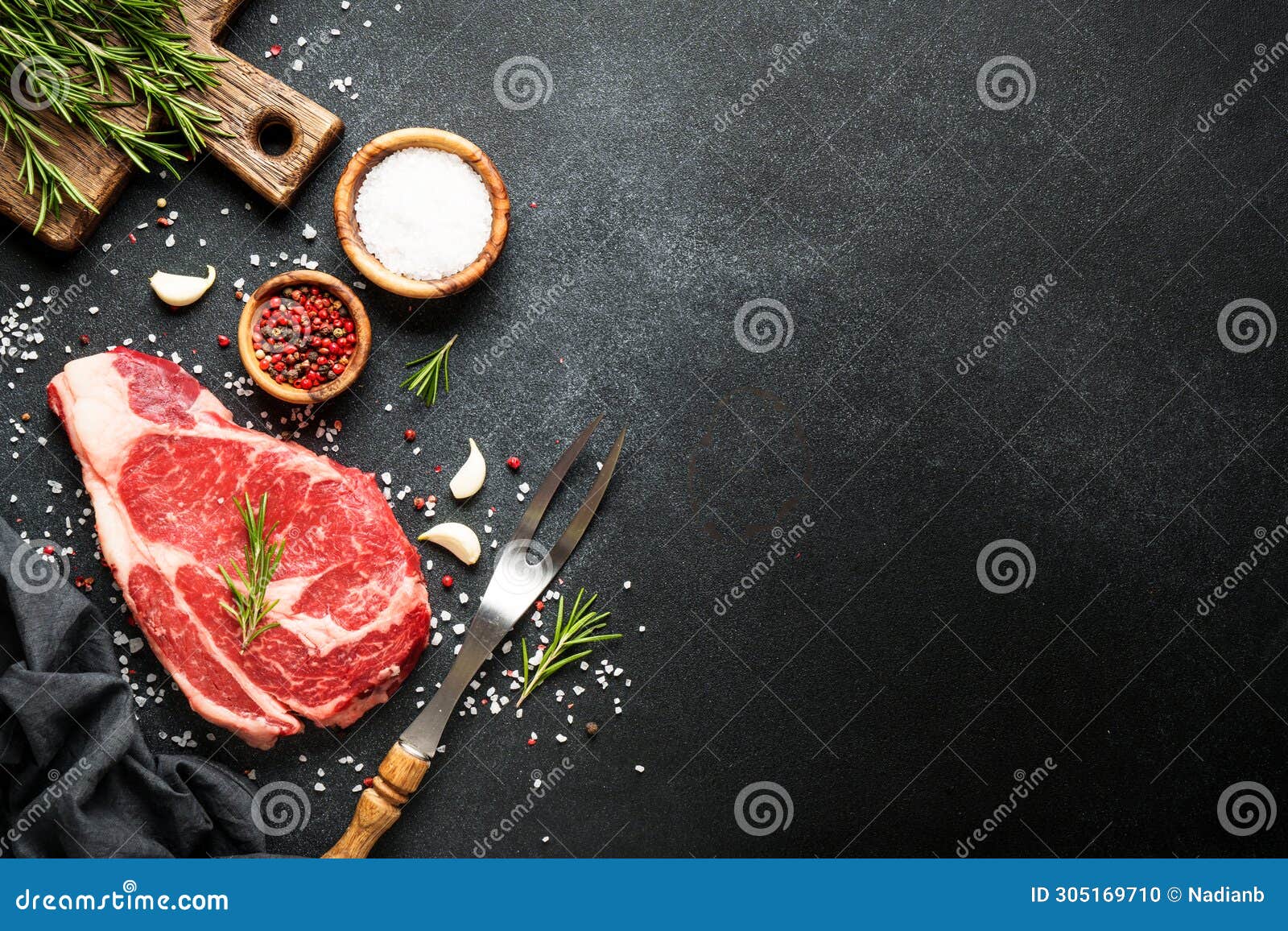 Beef Steak Ribeye with Spices and Herbs on Black Background. Stock ...