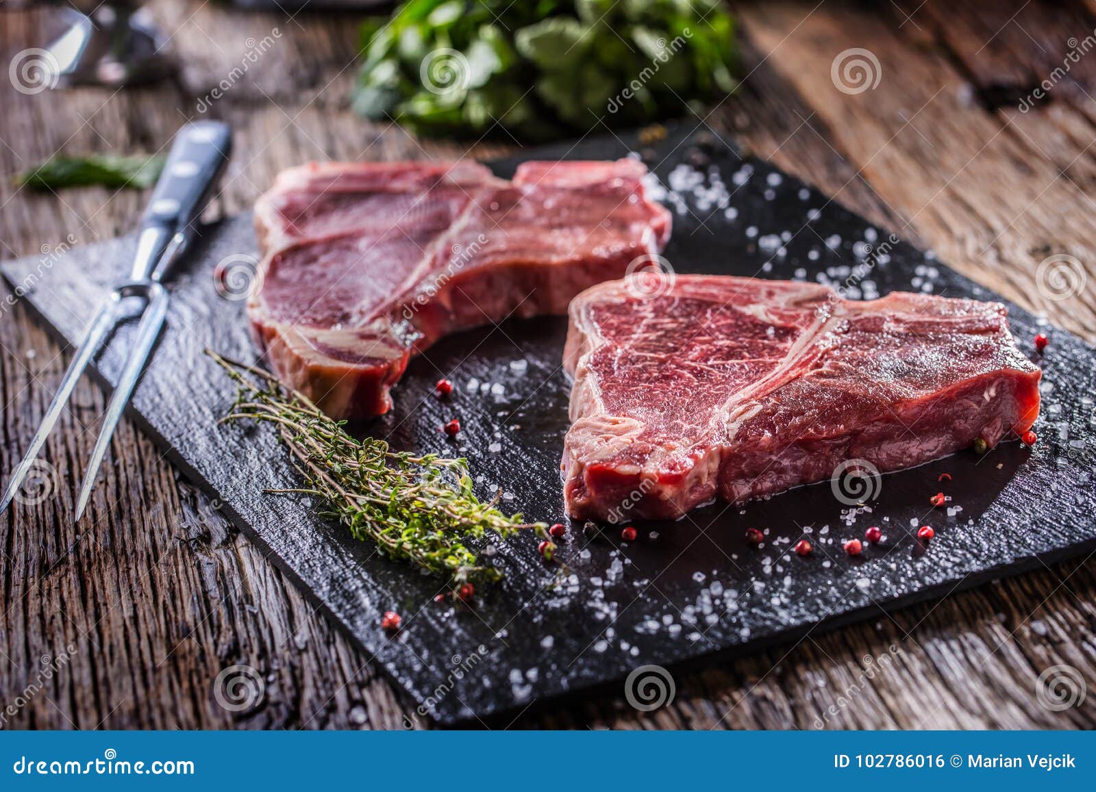 Beef Steak T-bone. Raw Beef Steak T-bone on Slate Board with Sal Stock ...