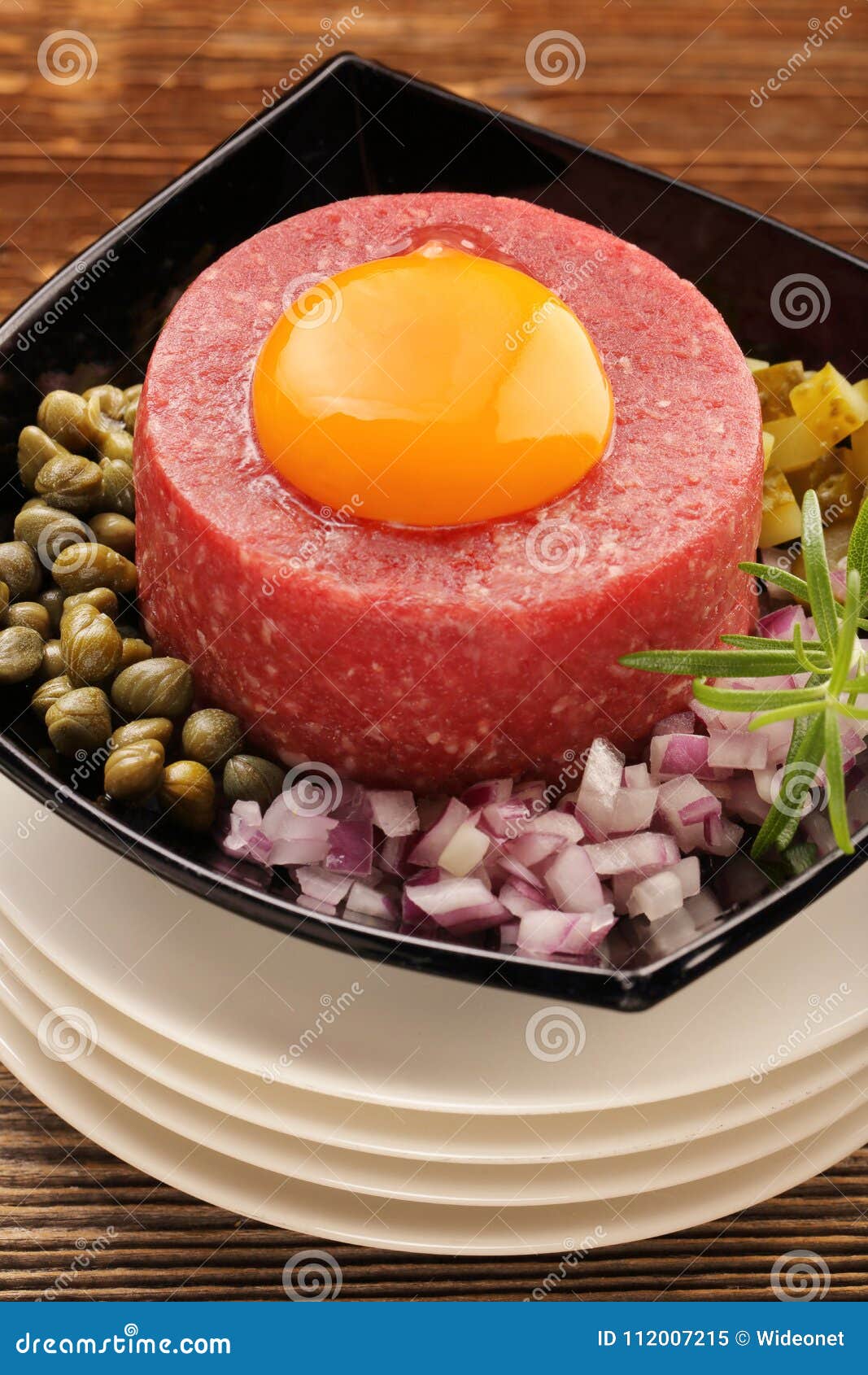 Beef Steak Tatare with Egg, Onion, Cucumber and Capers Stock Image ...