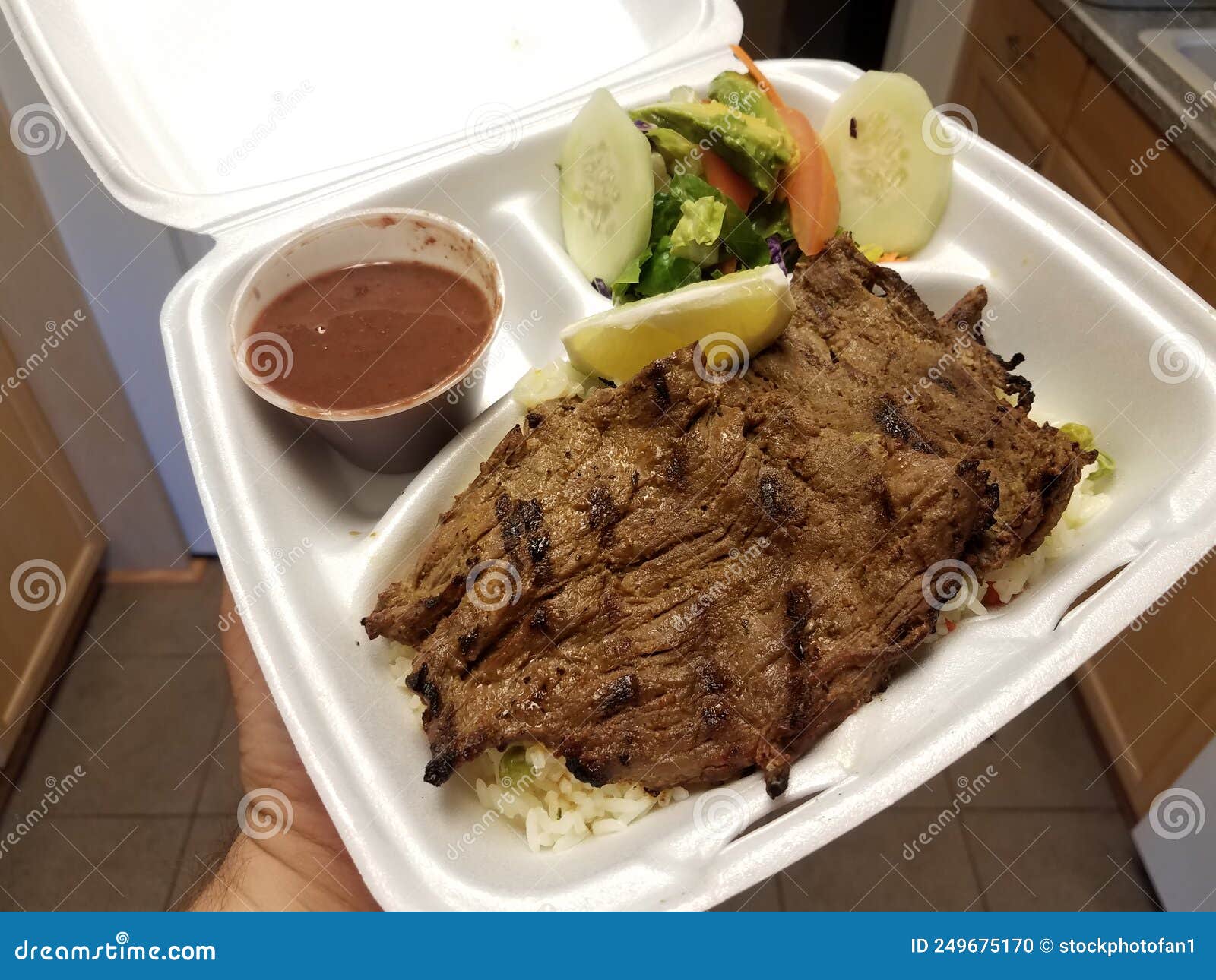Beef Steak with Vegetables in Take Out Container Held in Kitchen Stock ...