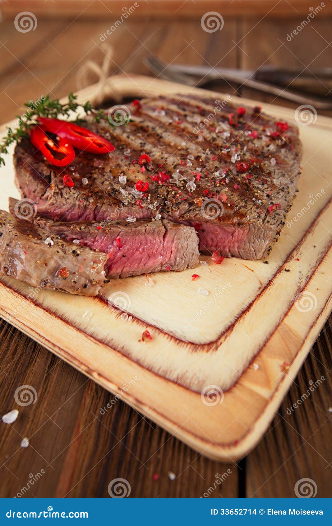 Beef Steak on a Wooden Board and Table Stock Photo - Image of juicy ...