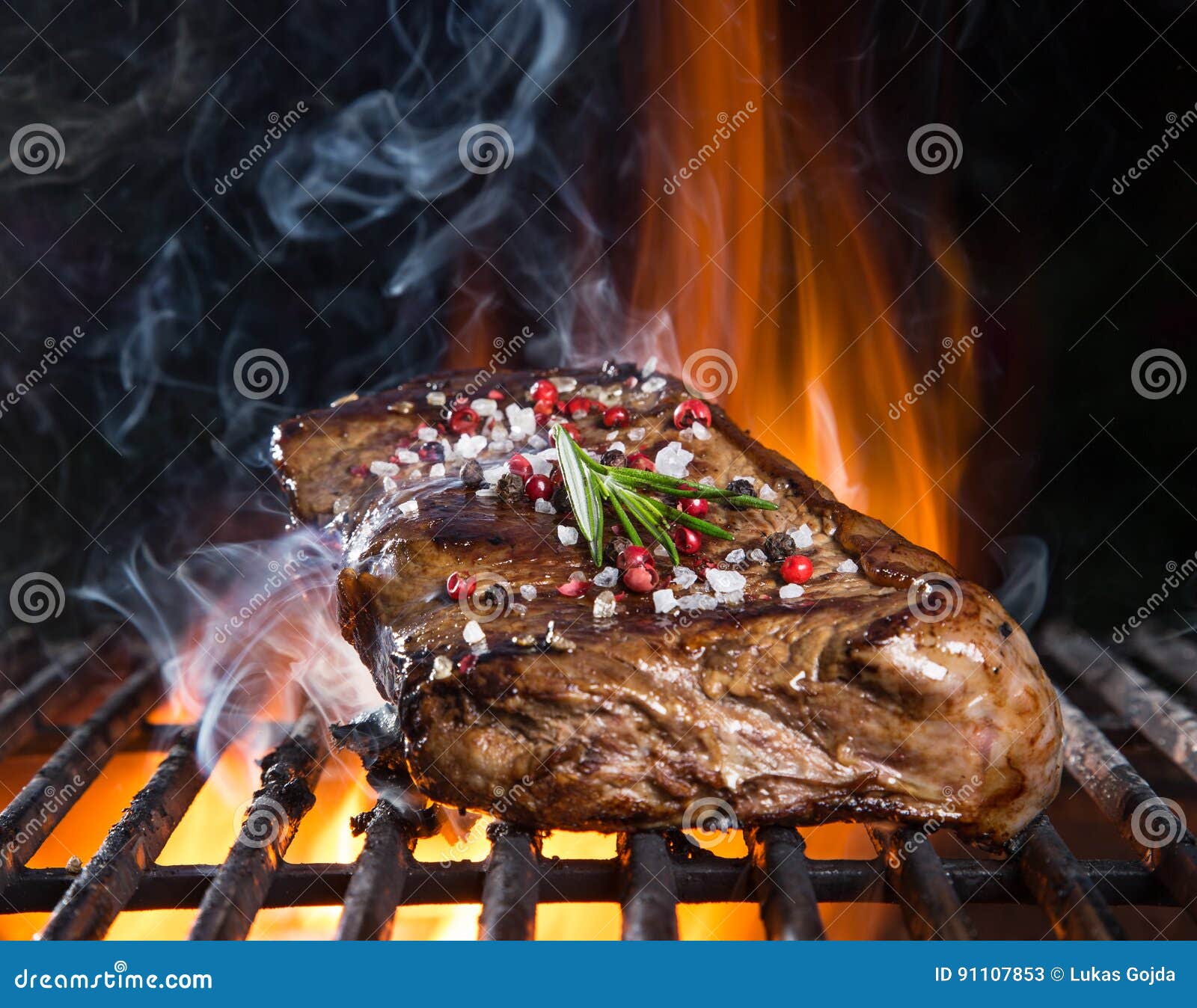 Beef Steaks on the Grill with Flames Stock Image - Image of flavoring ...