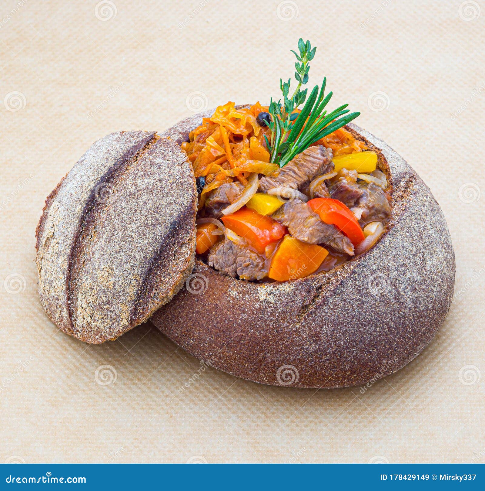 Beef stew in bread bowl stock image. Image of cuisine - 178429149