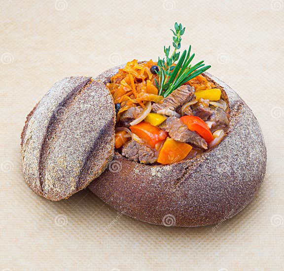 Beef stew in bread bowl stock image. Image of cuisine - 178429149
