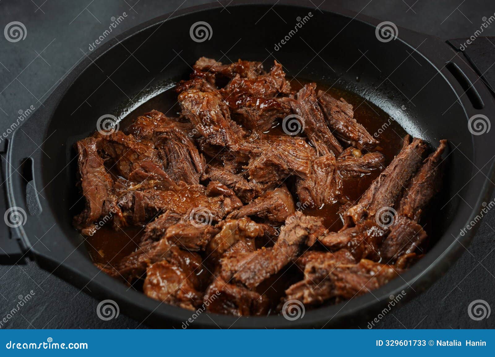 Beef Stew in a Cast Iron Skillet. Sliced Pieces of Braised Beef Stock ...