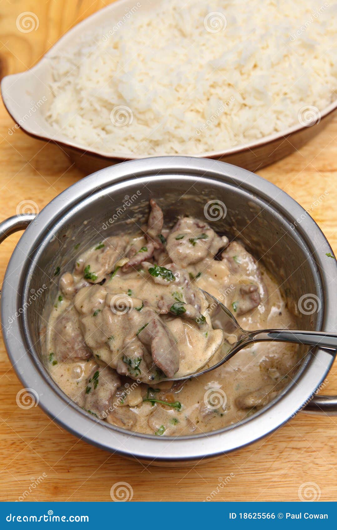 Beef Stroganoff and Rice Vertical Stock Photo - Image of serving, meat ...
