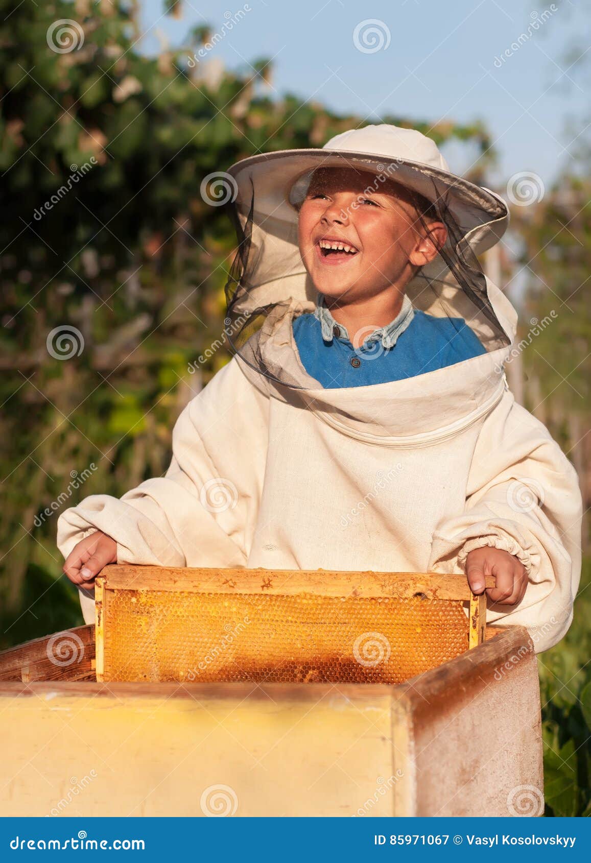 Beekeeper a Young Boy Who Works in the Apiary. Beekeeping. Stock Image ...