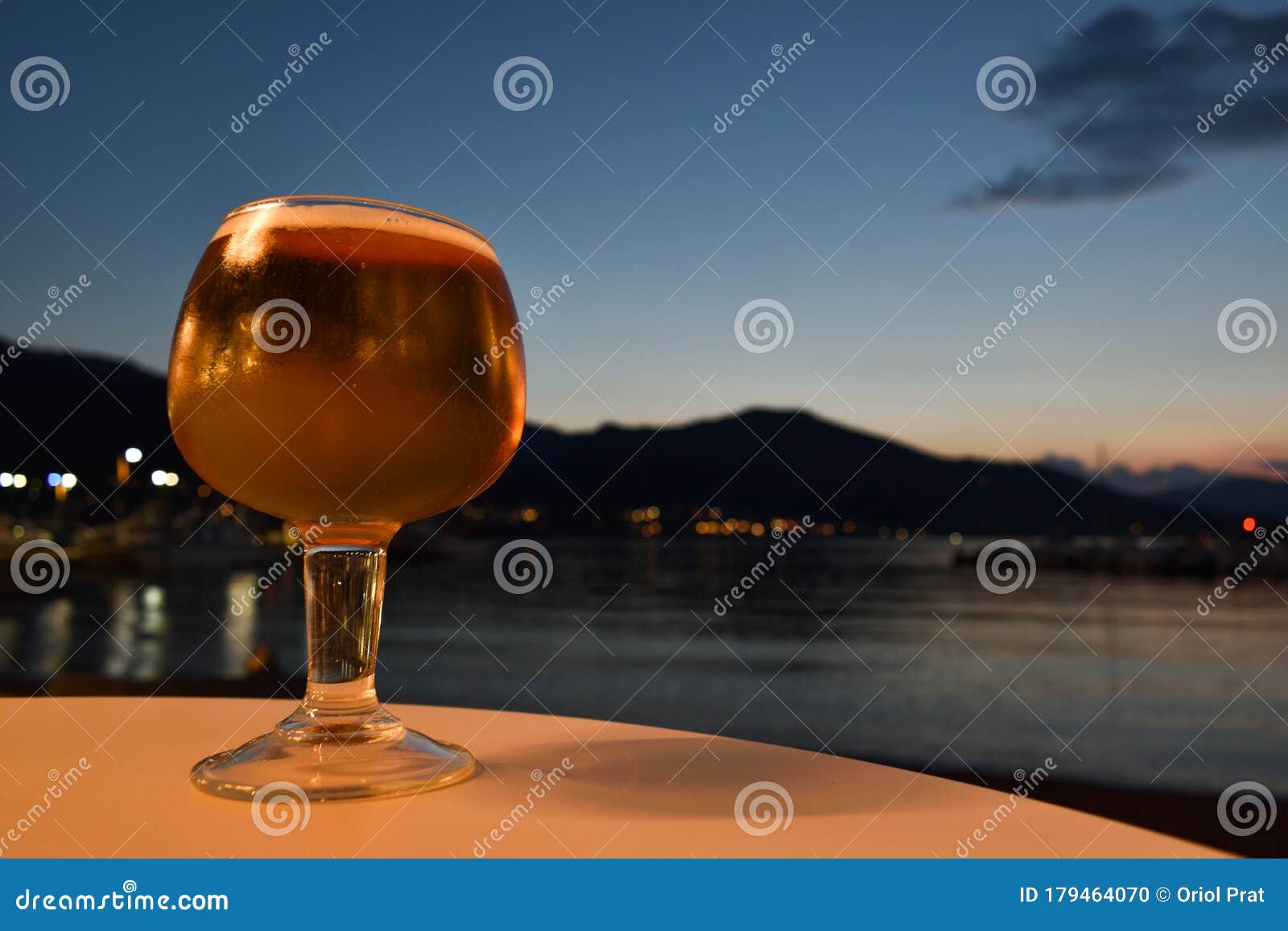 Beer on a Bar Table with Sunset Stock Photo - Image of background ...
