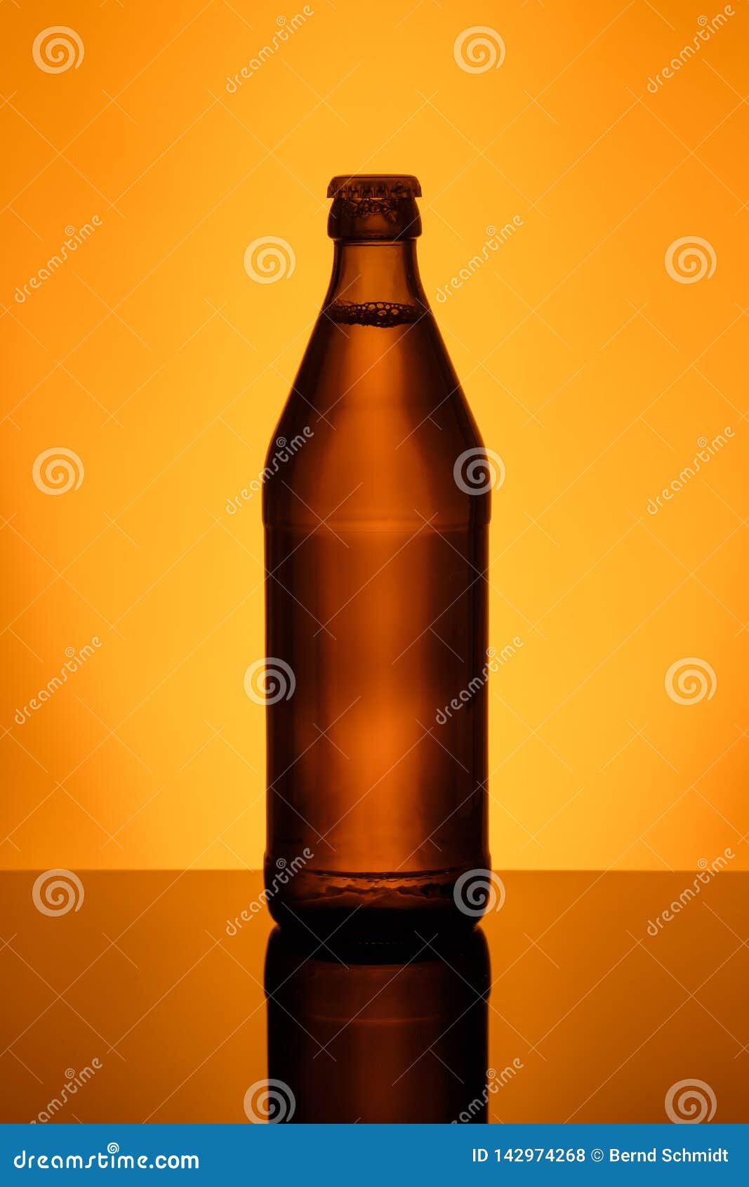 Beer Bootle with Crown Cap in Back Lit Stock Photo - Image of beer ...