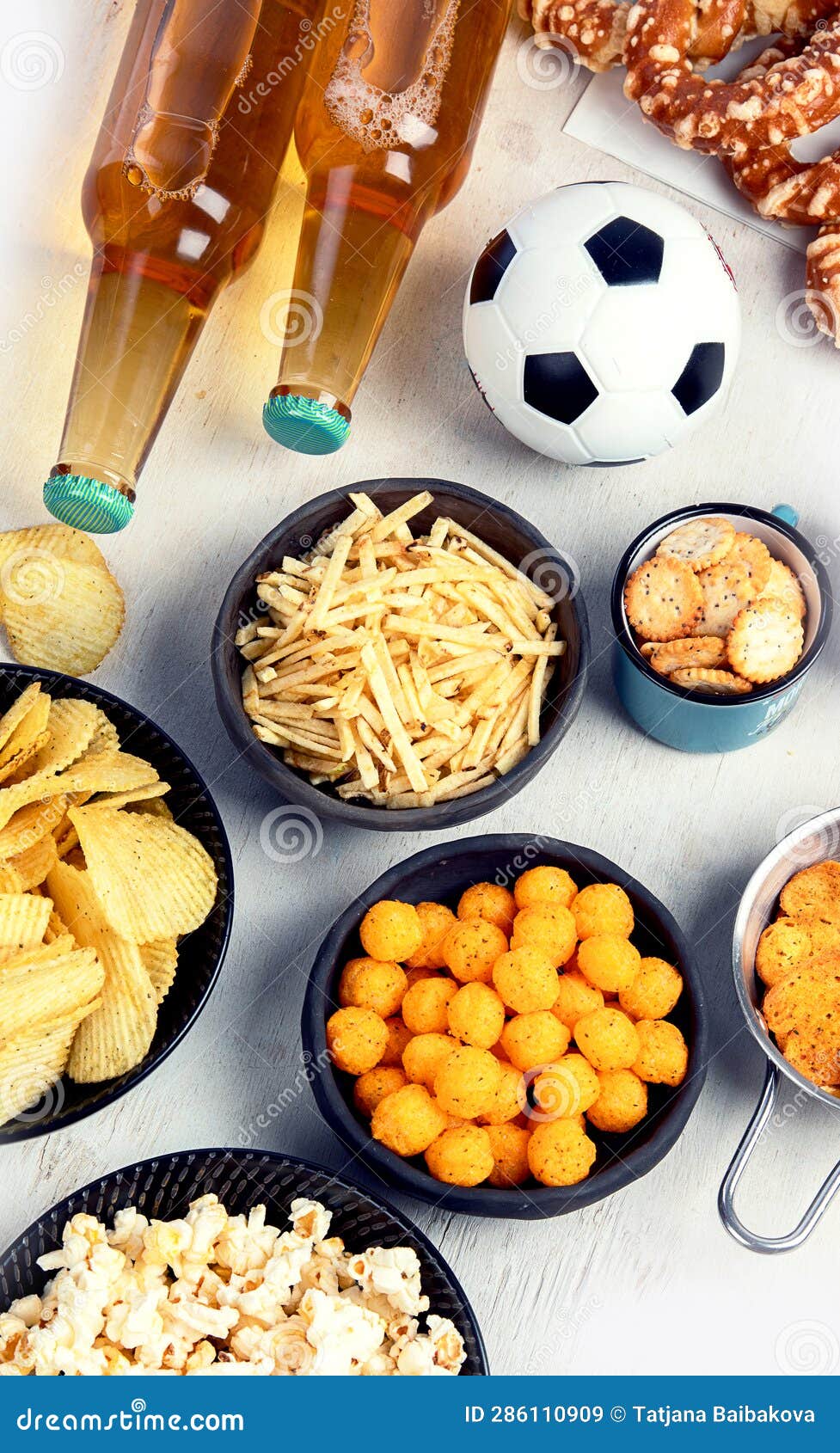 Beer Bootles, Snacks and Ball on Table Stock Image - Image of finger ...