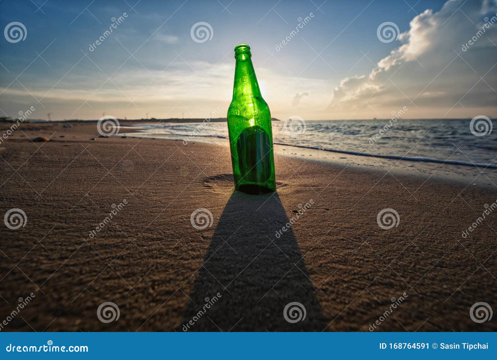 Beer Bottle on a Sandy Beach Stock Image - Image of bright, foam: 168764591