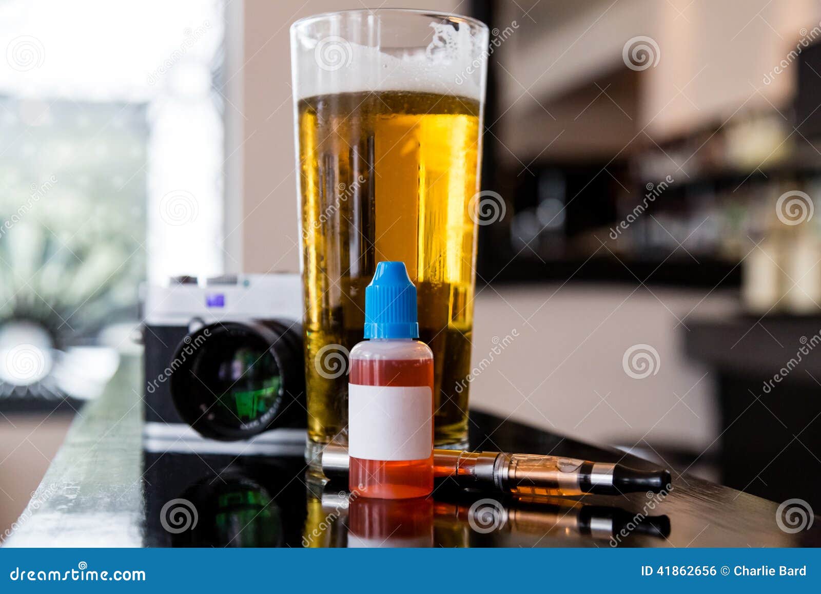 Beer, Camera, Vaping Juice and Vaporizer Stock Photo - Image of ...
