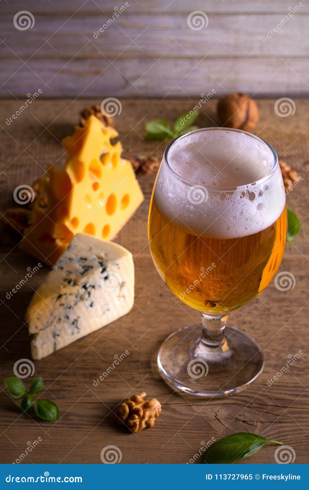 Beer and Cheese. Beer Glass on Wooden Table. Ale and Appetizer Snack ...