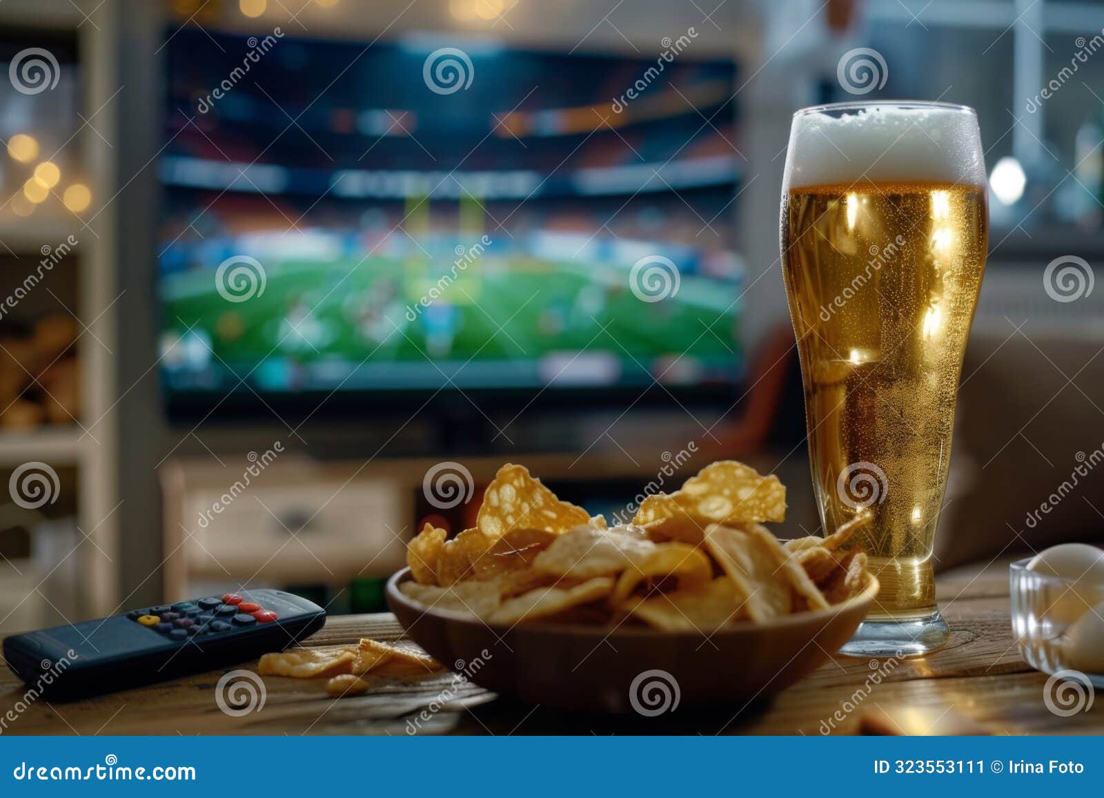 Beer, Chips, and Remote with Football Match on TV Stock Image - Image ...