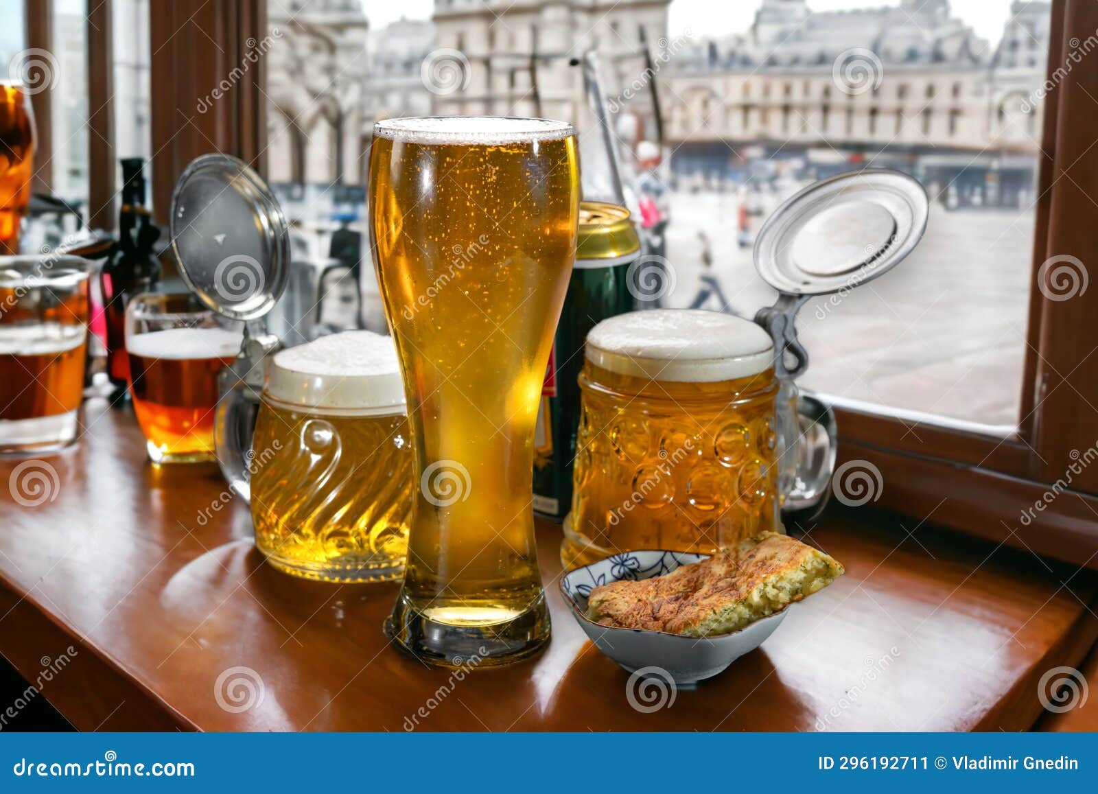 Beer in a Beer Glass and Beer Mugs Stand on the Window of a Pub. Stock ...