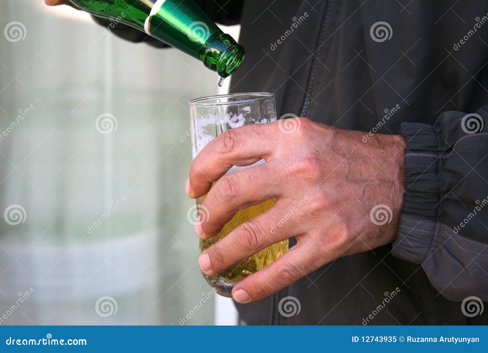 Beer in hand stock image. Image of relaxing, single, green - 12743935