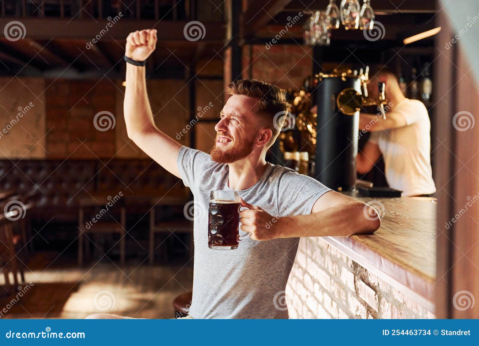 With Beer. Man in Casual Clothes Sitting in the Pub Stock Photo - Image ...