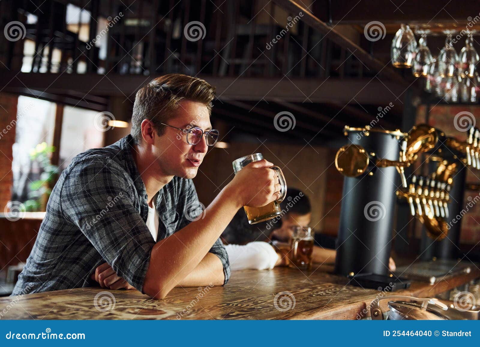 With Beer. Man in Casual Clothes Sitting in the Pub Stock Photo - Image ...