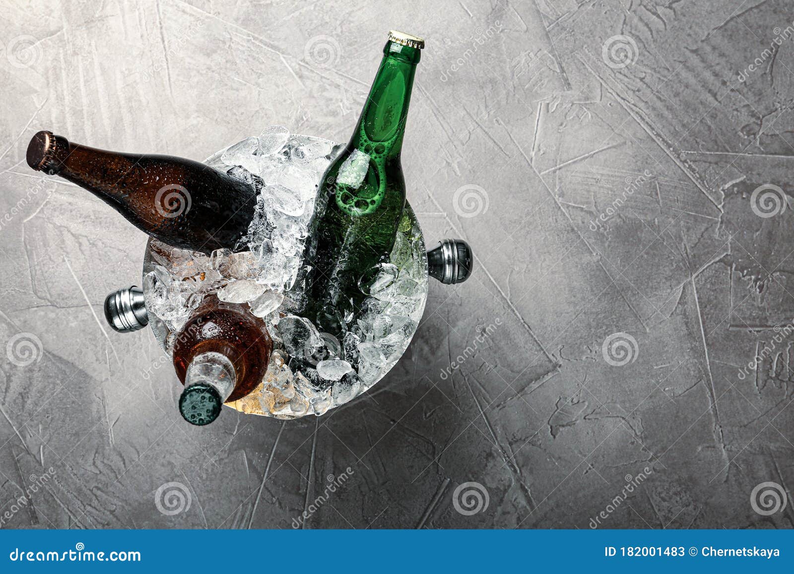 Beer in Metal Bucket with Ice on Grey Table. Space for Text Stock Image ...