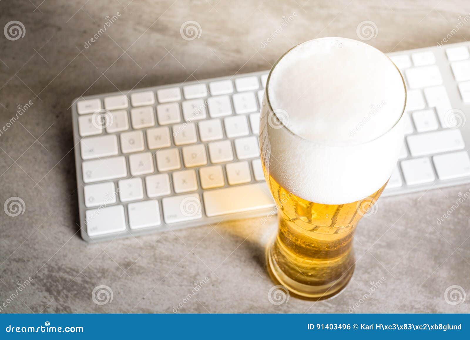 Beer Next To Computer Keyboard on Concrete Table Stock Photo - Image of ...