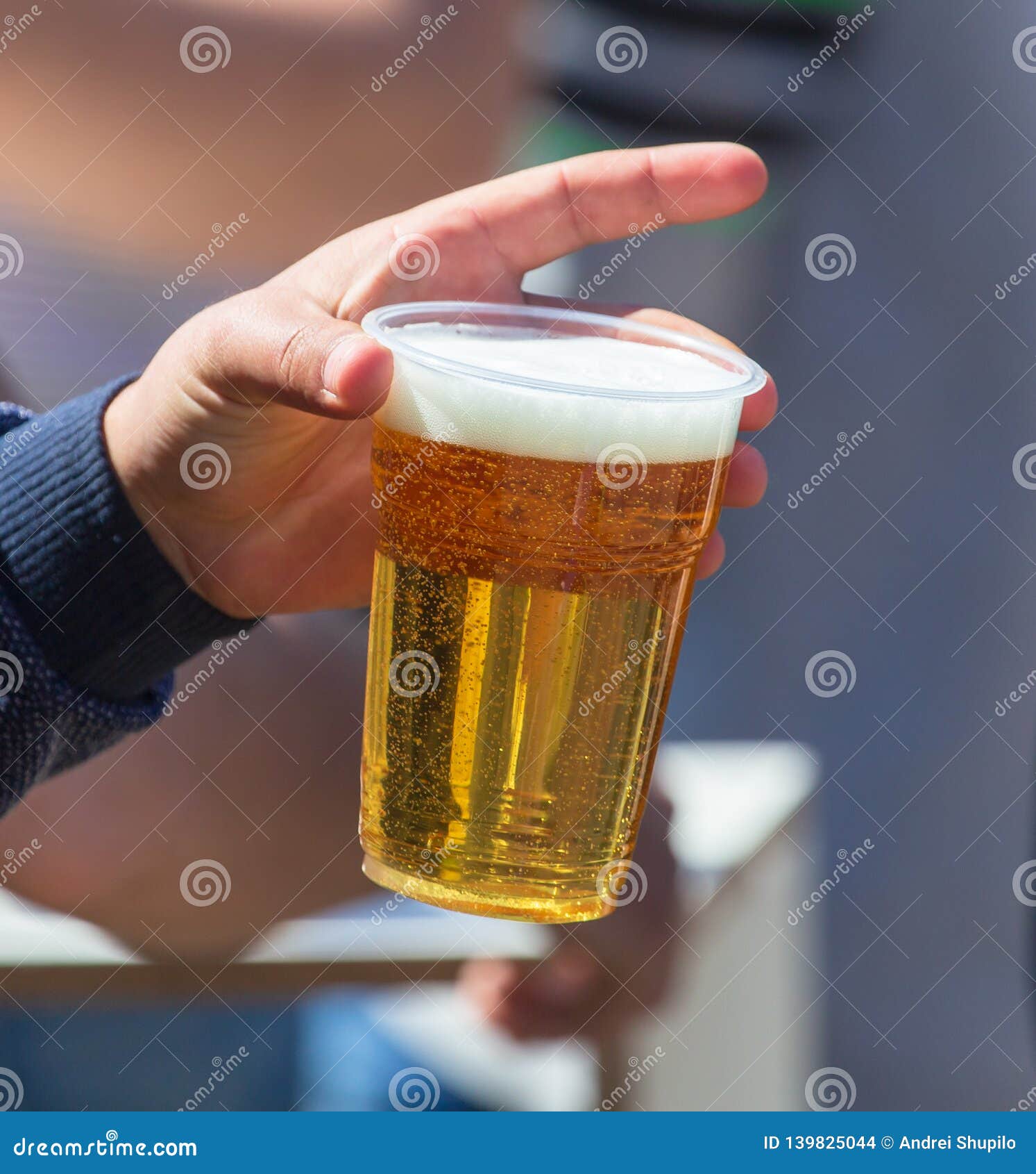 Beer in a Plastic Cup in Hand Stock Photo - Image of hand, cheers ...