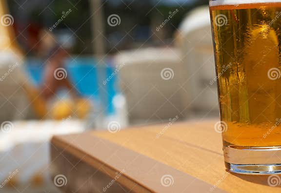 Beer at pool stock photo. Image of drink, foam, pool, beer - 801388