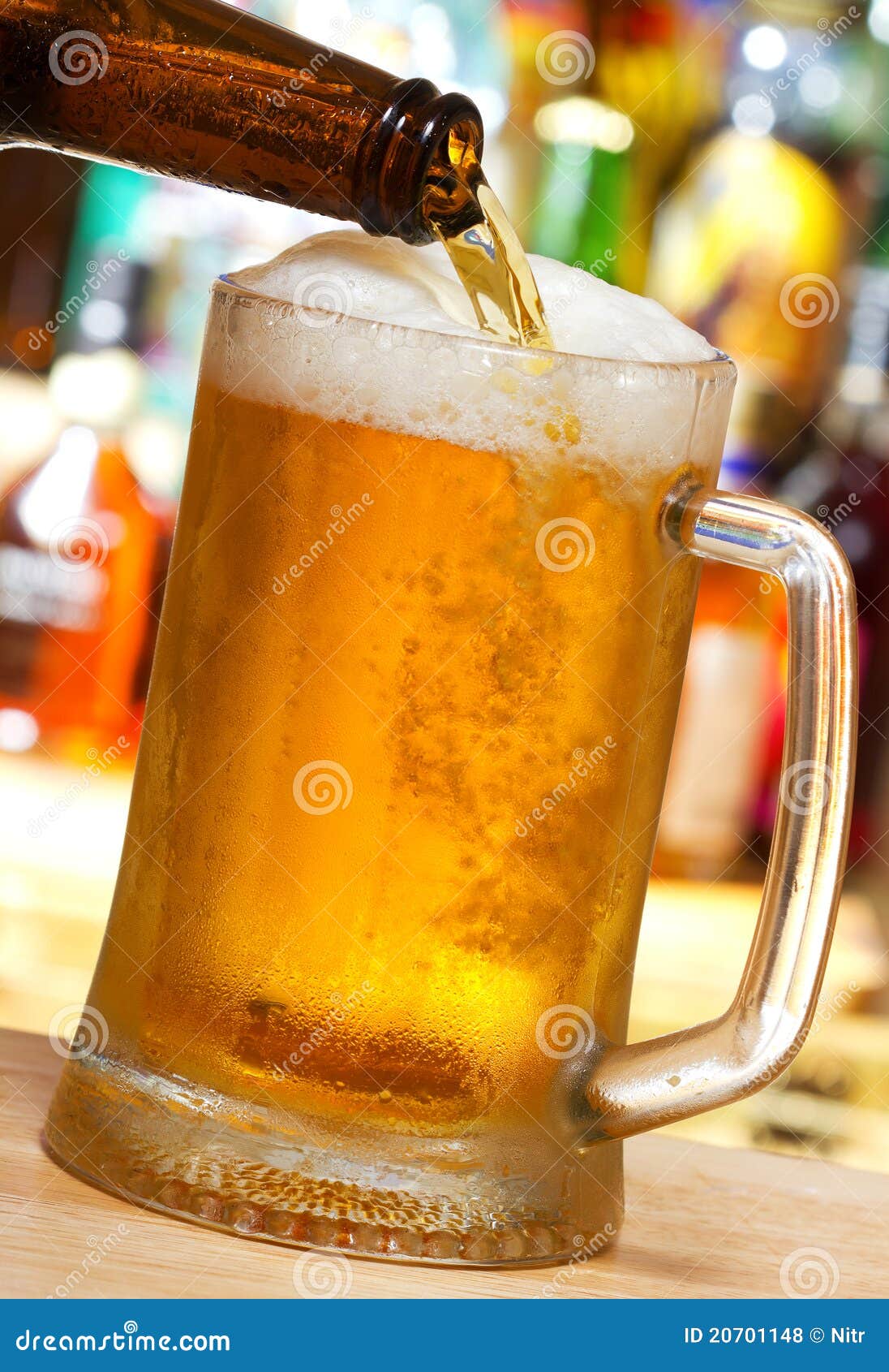 Beer pouring into mug stock photo. Image of pouring, gold - 20701148