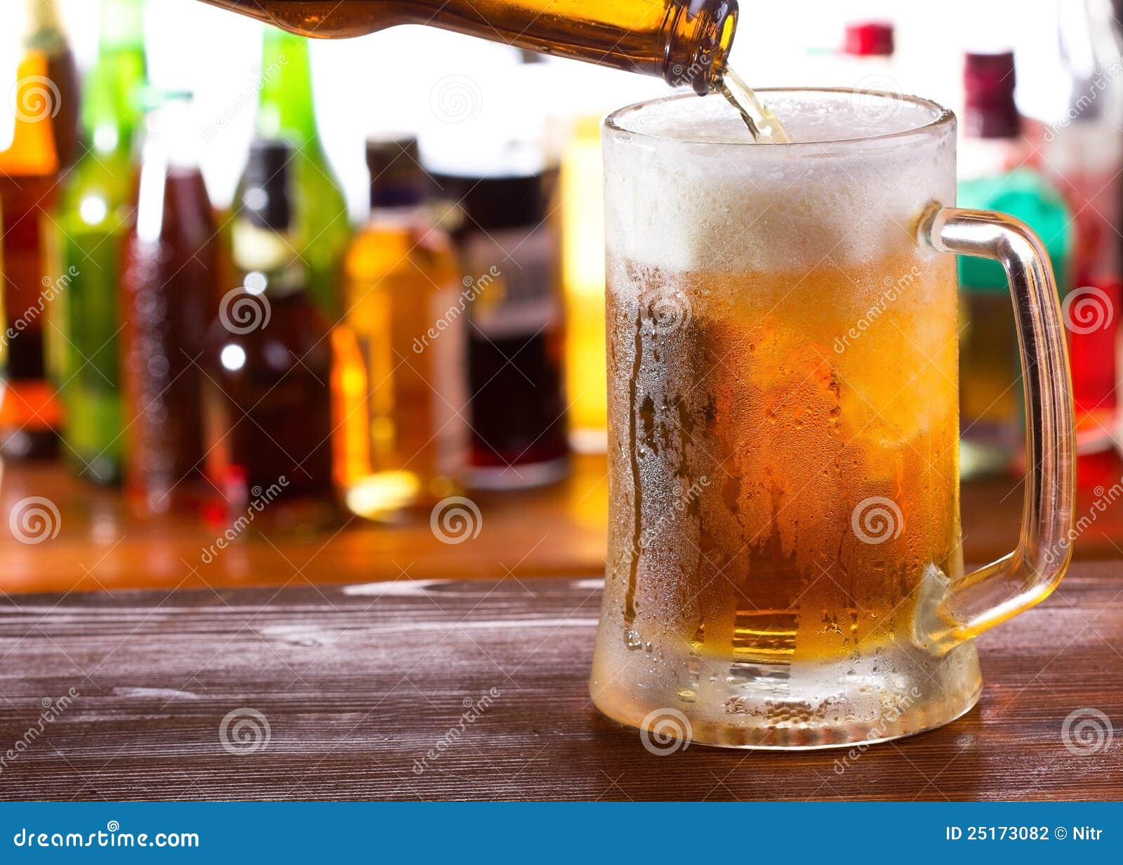 Beer pouring into mug stock photo. Image of gold, condensation - 25173082