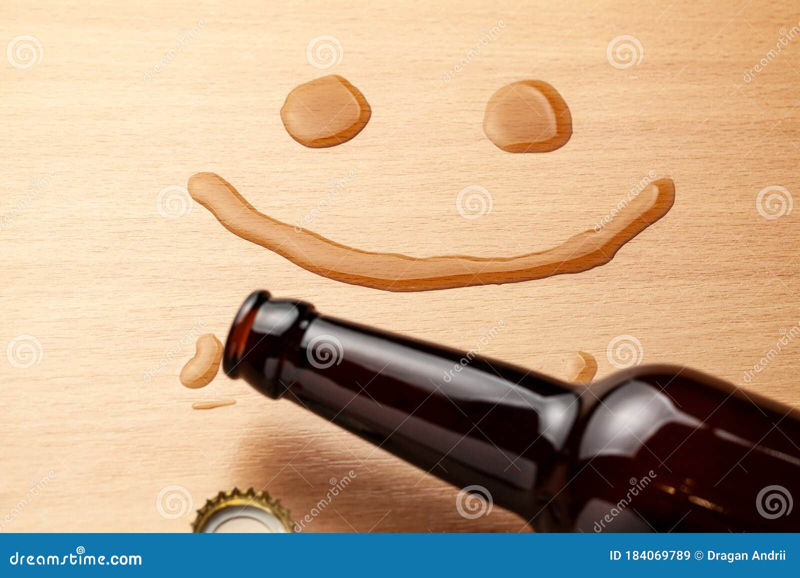Beer Smile. Beer Bottle and Spilled Drink on the Table Stock Image ...