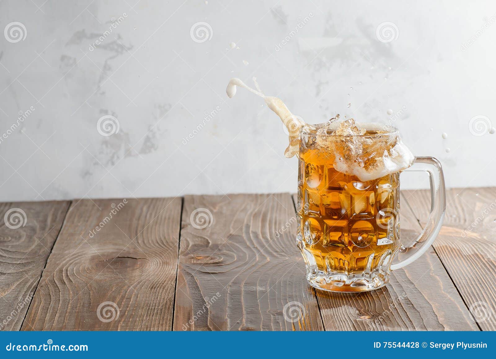 Beer Splash in Glass on a Wooden Background Stock Photo - Image of ...