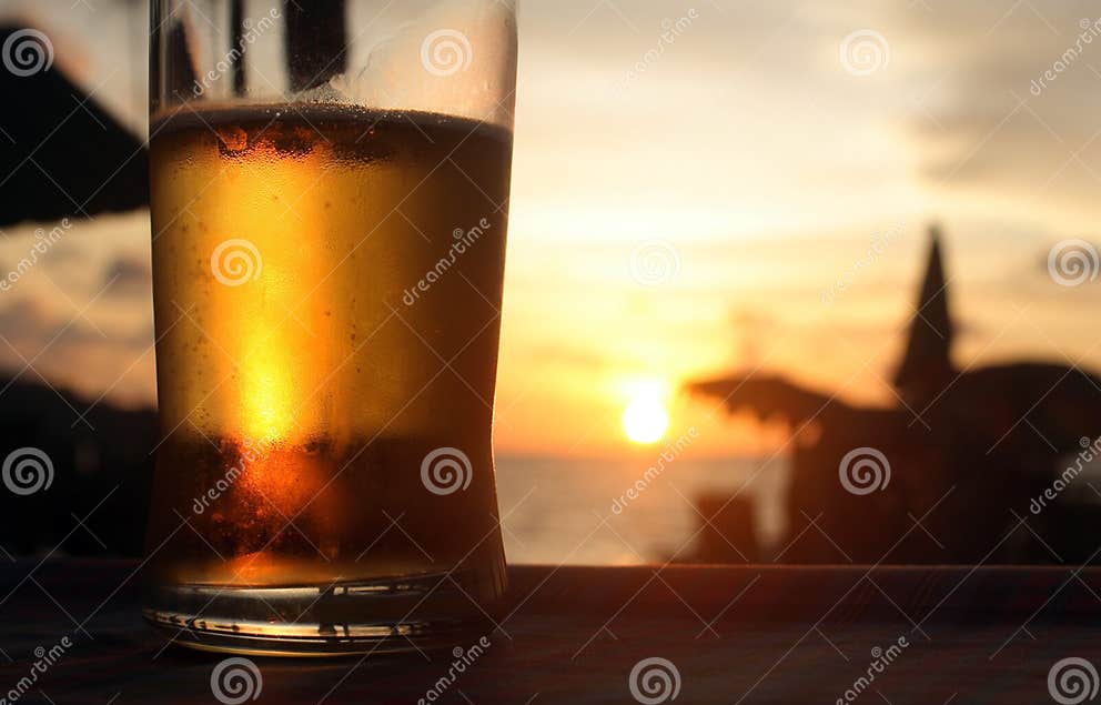 Beer in the sunset stock image. Image of sunlight, yellow - 12041869
