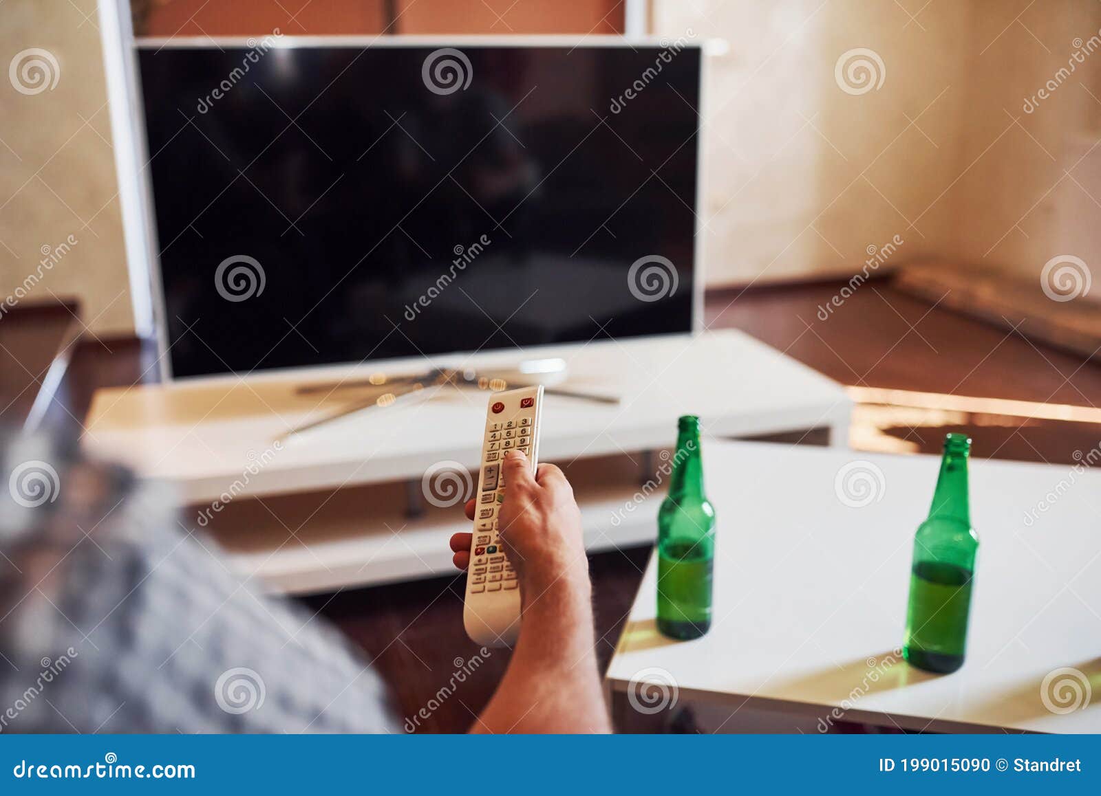 With Beer on Table. Backing View of Man Holds Remote Controller in Hand ...