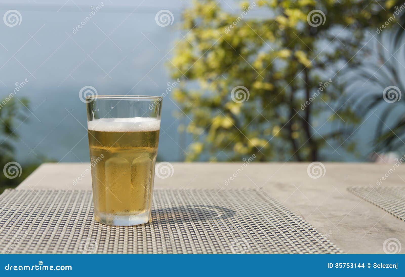 Beer on a table stock photo. Image of lager, full, light - 85753144