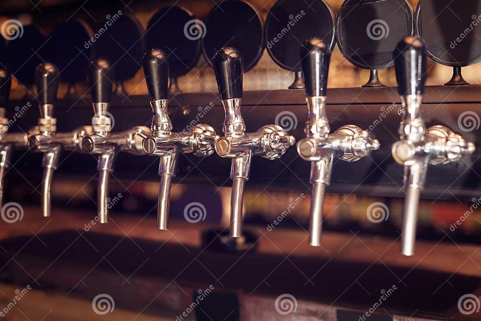 Beer Tap Row. Beer Taps in Bar Stock Photo - Image of handle, gold ...