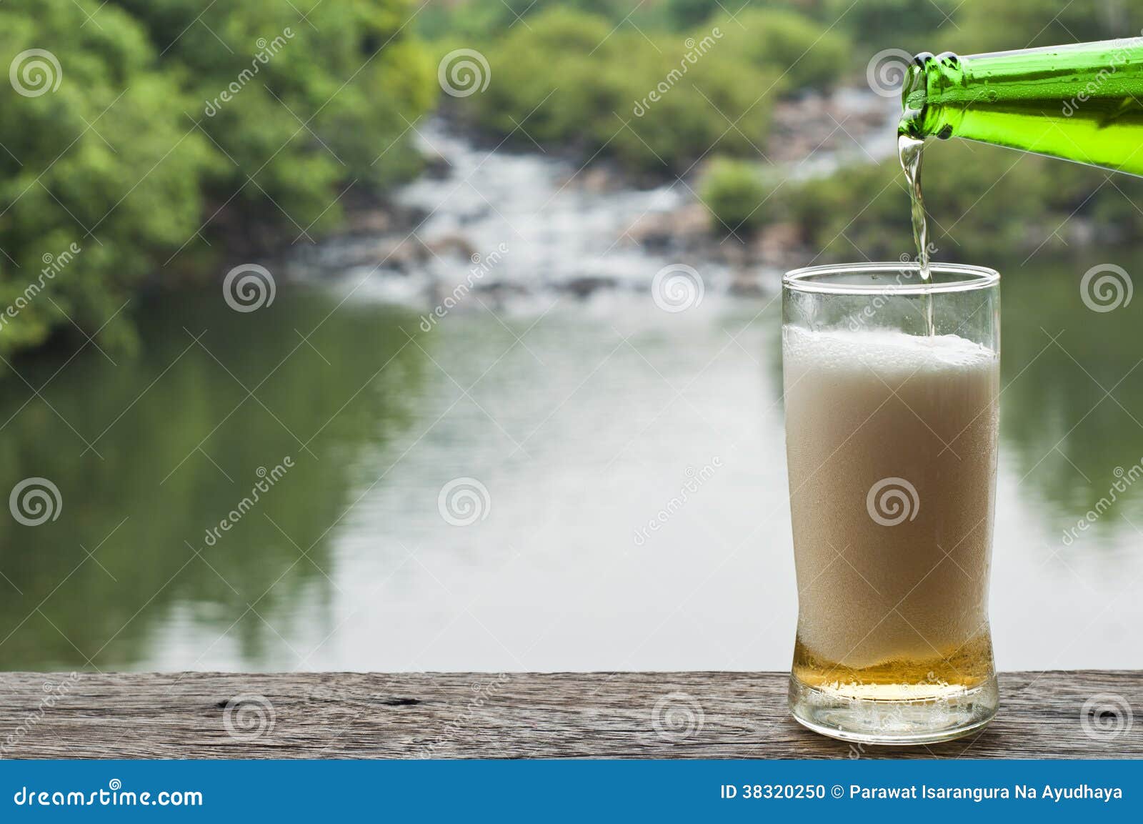 Beer at waterfall. stock photo. Image of green, pouring - 38320250