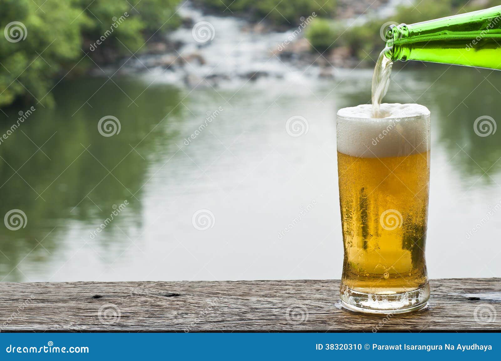Beer at waterfall. stock photo. Image of closeup, refreshment - 38320310