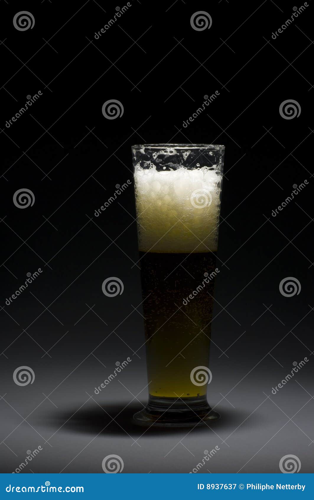 Beerglass lit from above stock image. Image of light, alcoholic - 8937637