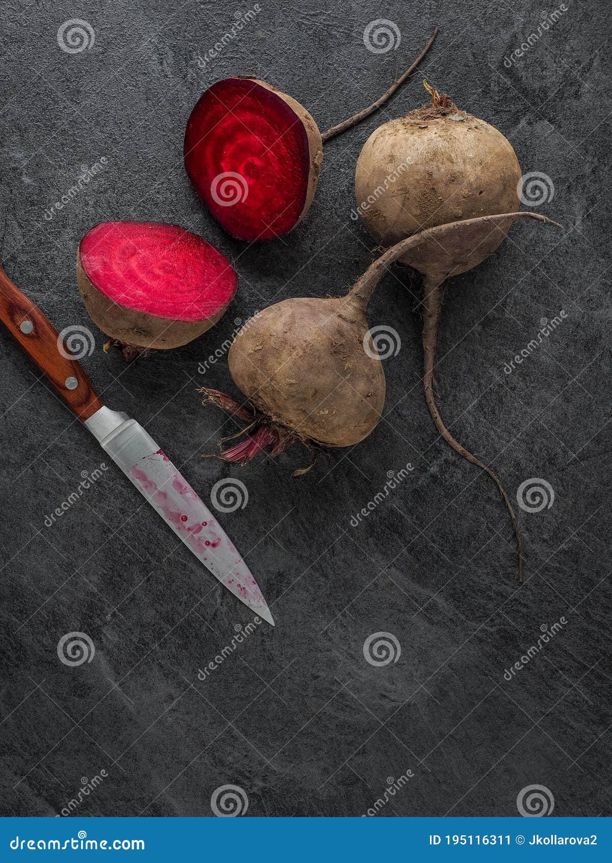Beetroot Cut in Half and Knife on Dark Table. Overhead Shot Stock Image ...