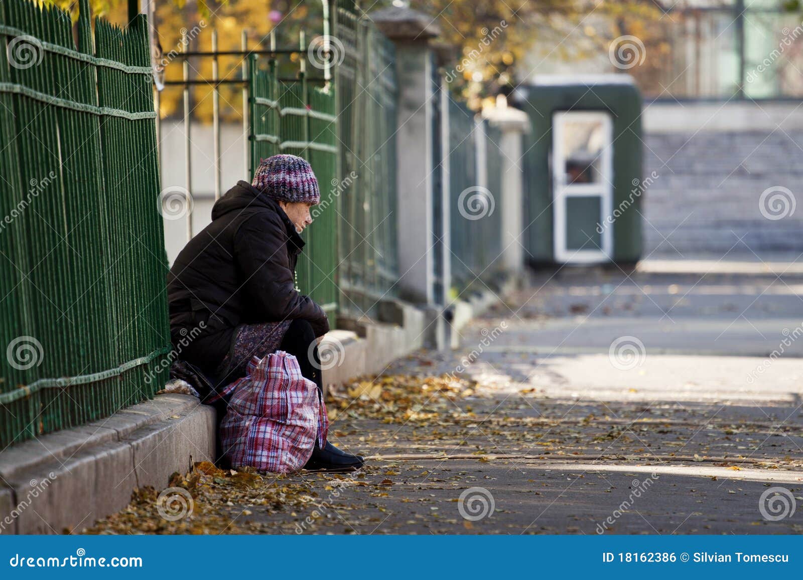 Beggar on the sidewalk editorial photo. Image of women - 18162386