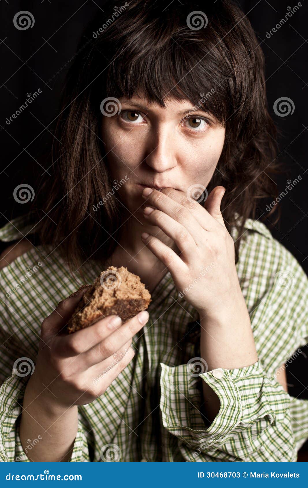 Beggar woman eating bread stock image. Image of charity - 30468703