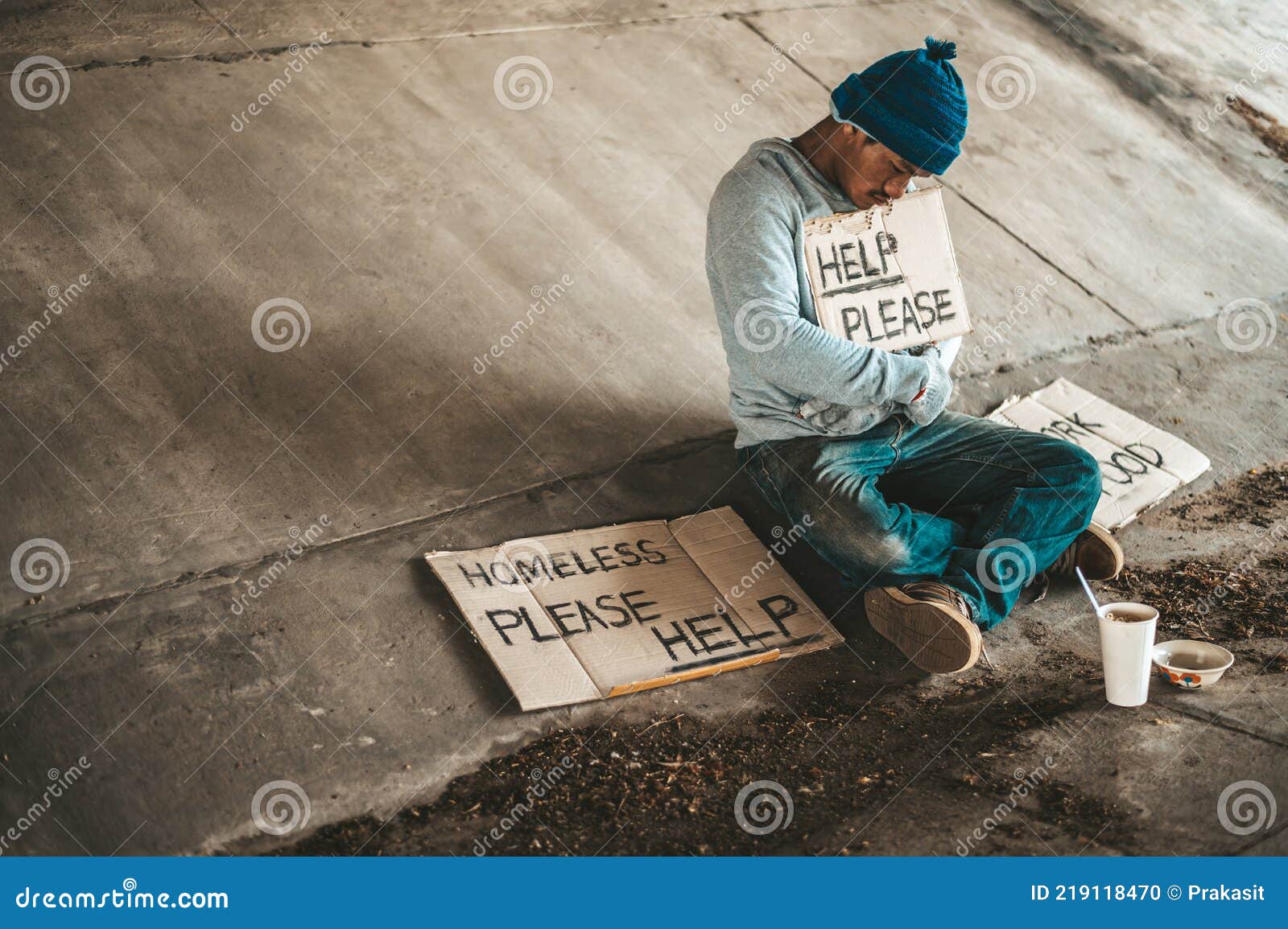 Beggars Sitting Under the Bridge with a Sign, Help Please Stock Photo ...