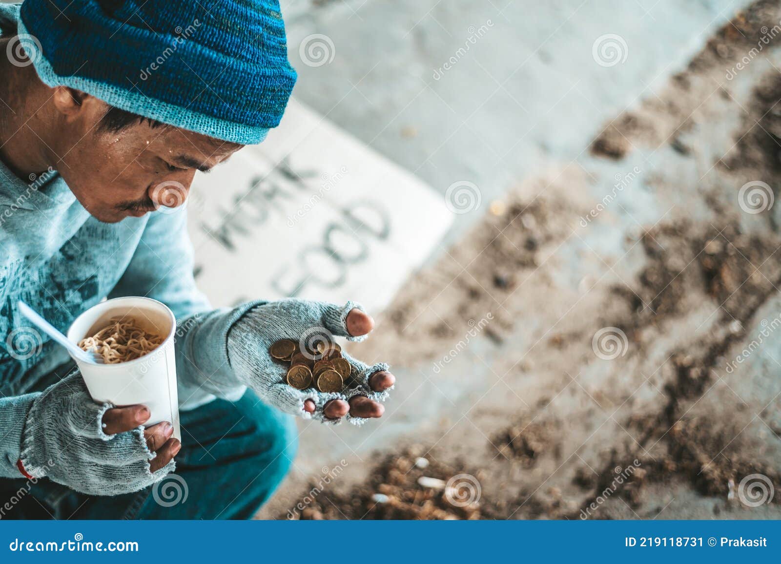 Begging Under the Bridge with a Cup Containing Coins and Instant ...